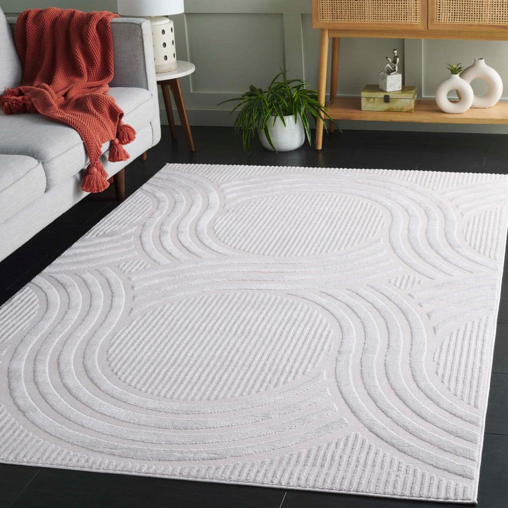 SAFAVIEH Saylor 5 ft. x 8 ft. Ivory Solid Swirl Striped Area Rug ...