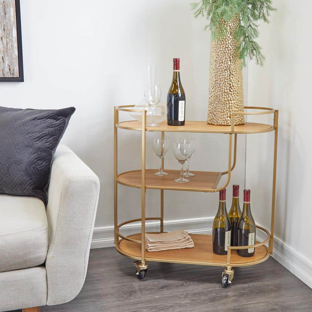 Litton Lane Gold Bar Cart with Oval Shape 043147 - The Home Depot