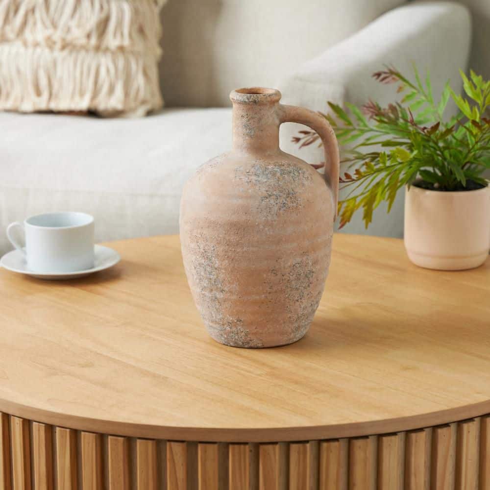Litton Lane 11 in. Beige Antique Style Distressed Ceramic Pitcher ...