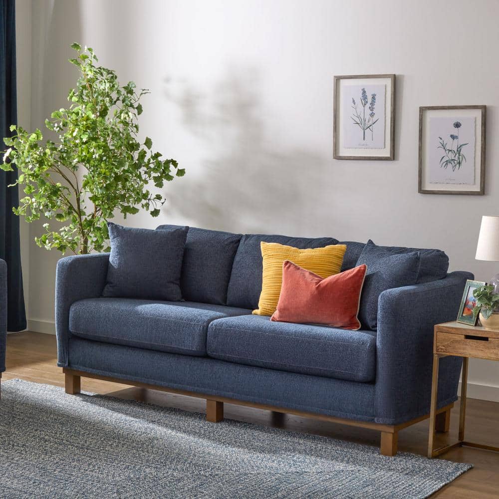 Navy cushions on grey sofa store