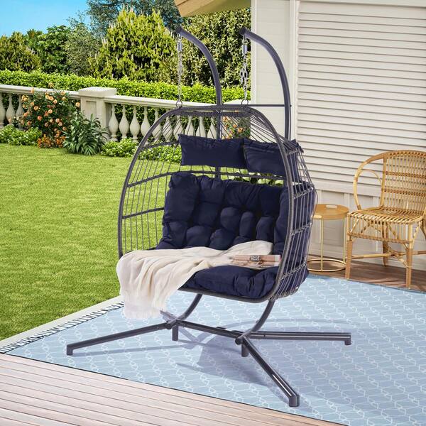2 Person 720 lbs. Outdoor Rattan Hanging Metal Patio Chair Wicker Egg Chair with with Black Stand and Dark Blue Cushions