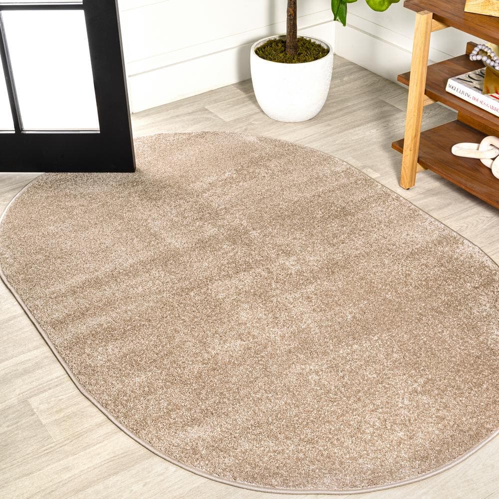 JONATHAN Y Haze Solid Low-Pile Beige 6 ft. x 9 ft. Oval Area Rug ...