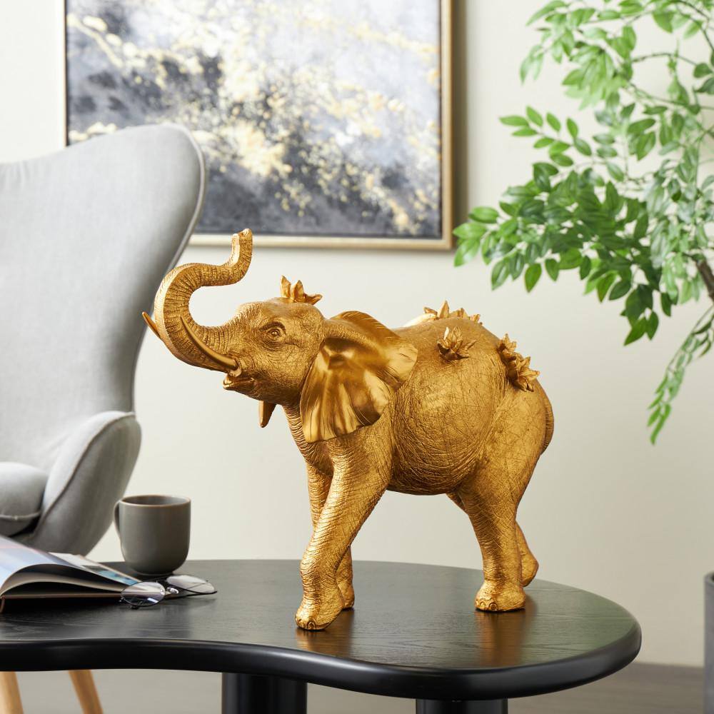 Litton Lane Gold Resin Walking Elephant Sculpture with Floral Accents ...