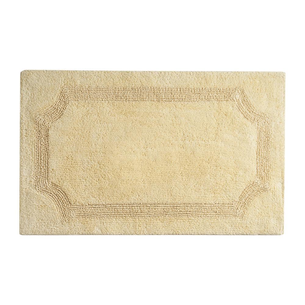 Laura Ashley Solid Reversible Yellow 21 in. x 34 in. Bath Mat ...