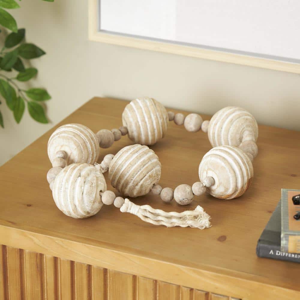 Litton Lane Beige Handmade Wood Ribbed Geometric Garland with Tassel ...